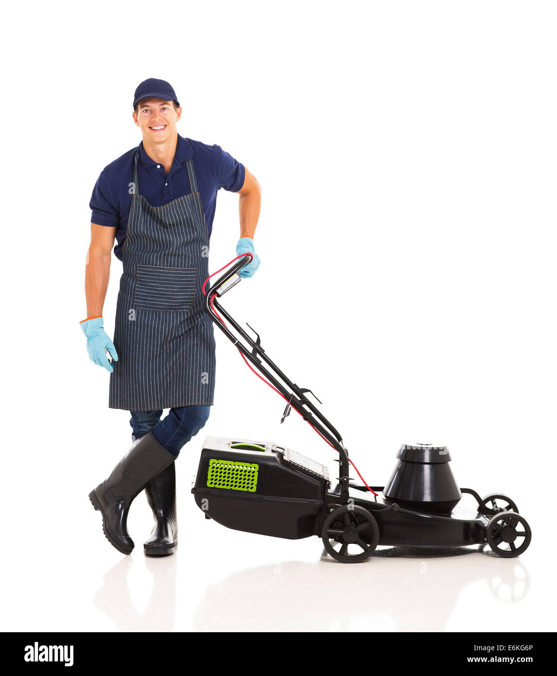 happy gardener standing next to a lawnmower isolated on white Stock ...