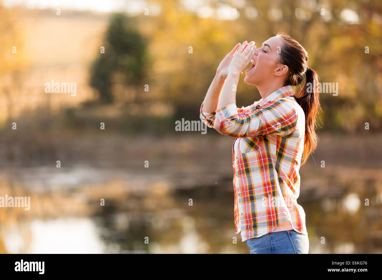 beautiful young woman shouting to the nature in autumn outdoors Stock ...
