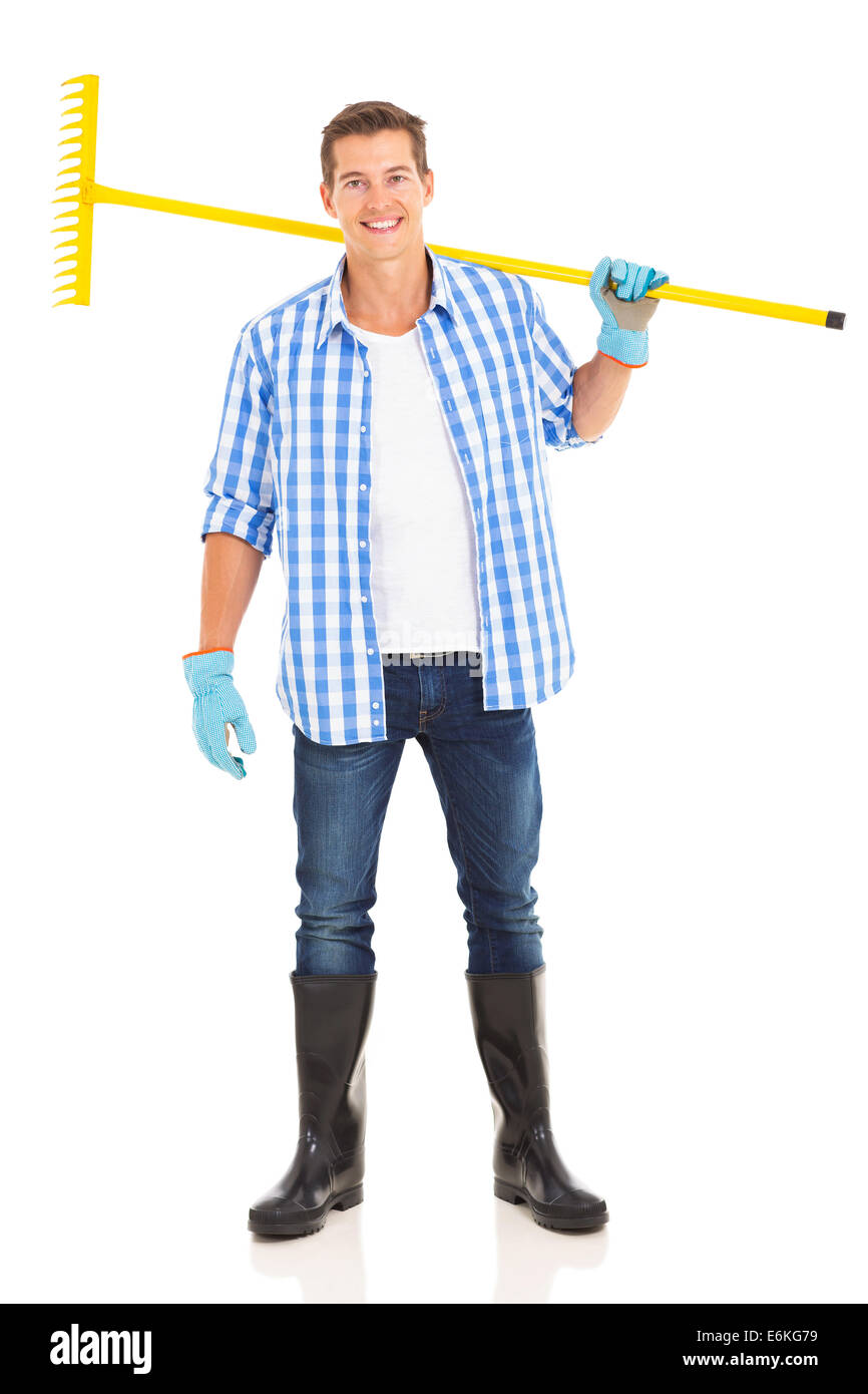 handsome man carrying a garden rake isolated on white Stock Photo - Alamy