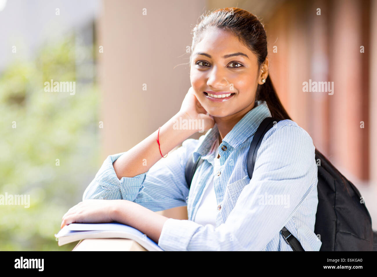 smiling college girl looking at the camera Stock Photo - Alamy