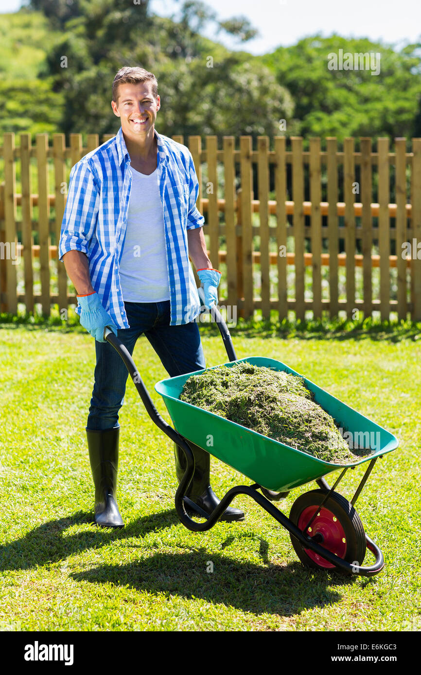 Man wheelbarrow hi-res stock photography and images - Alamy