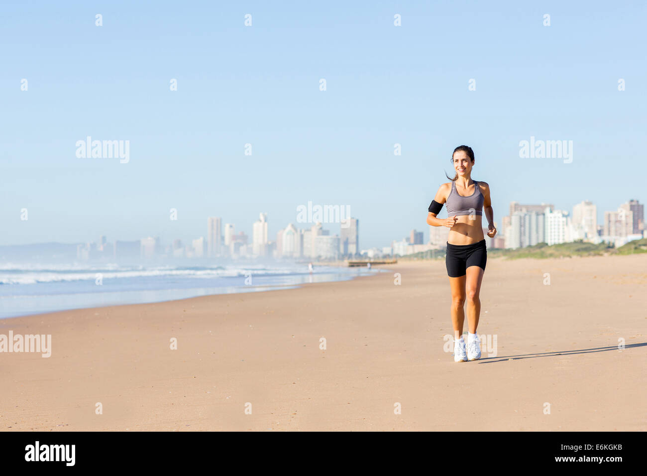 active woman jogging on beach in the morning Stock Photo - Alamy