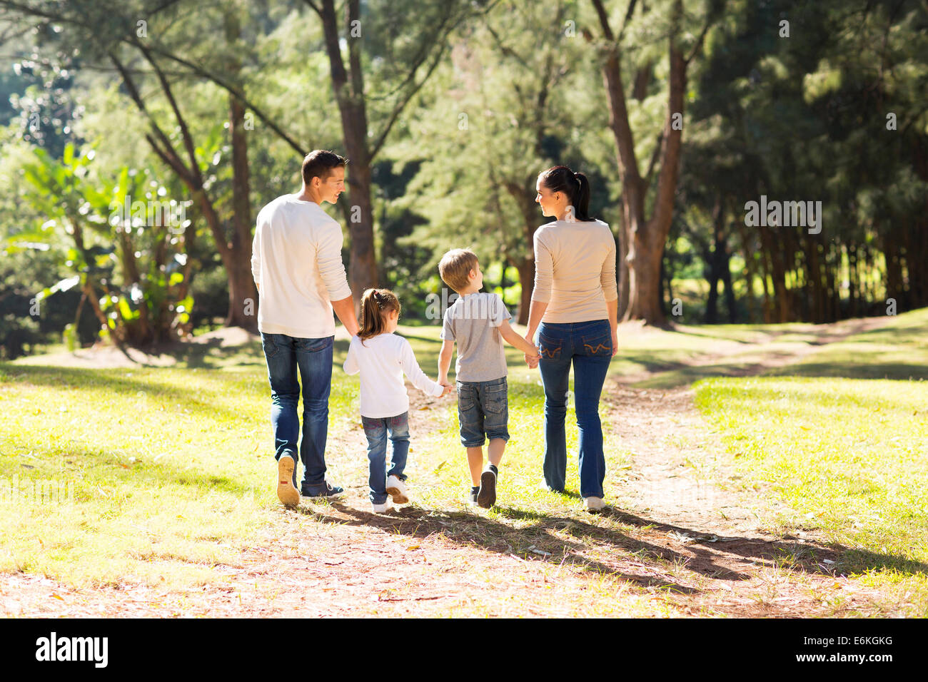 Woman walking kids rear hi-res stock photography and images - Alamy