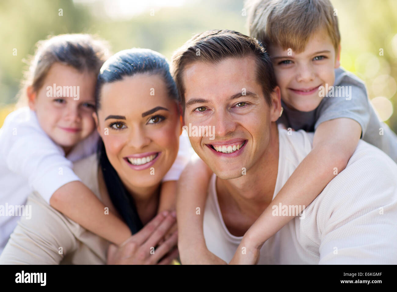 loving young family having fun together outdoors Stock Photo - Alamy