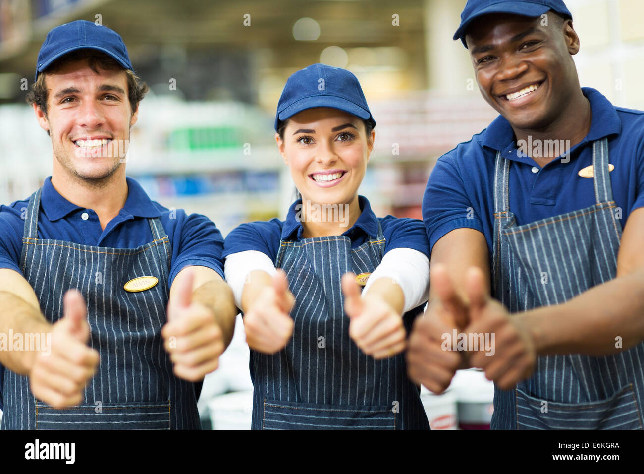 group of happy supermarket workers thumbs up Stock Photo - Alamy