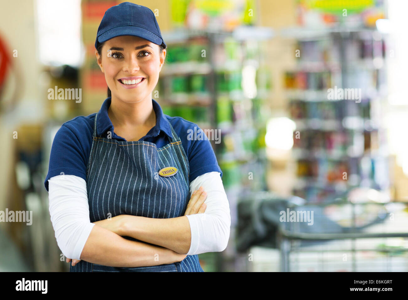 pretty hardware store employee looking at the camera Stock Photo - Alamy