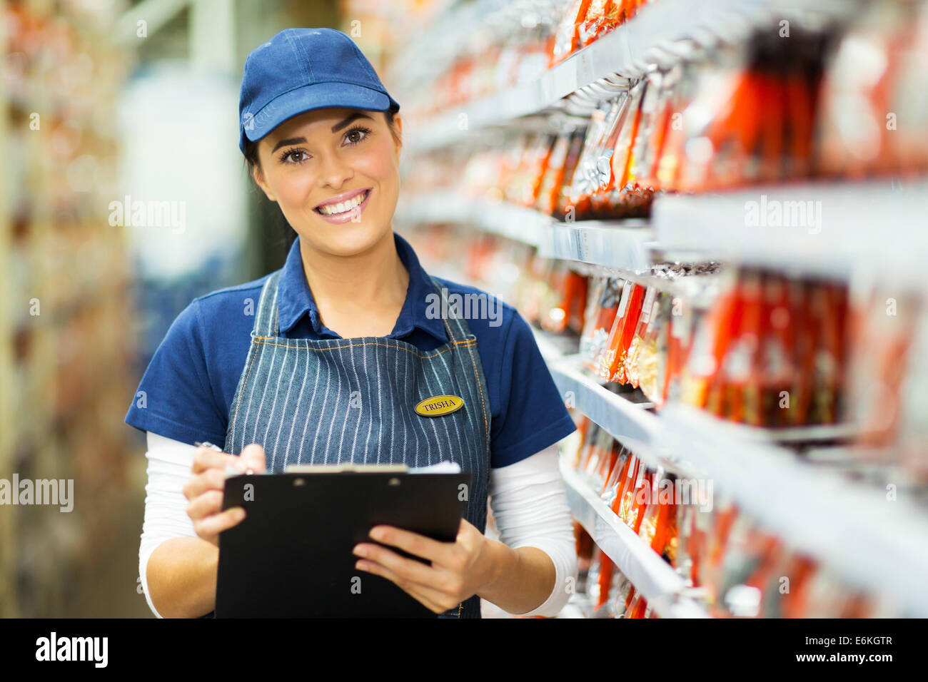 pretty hardware store worker holding clipboard Stock Photo - Alamy