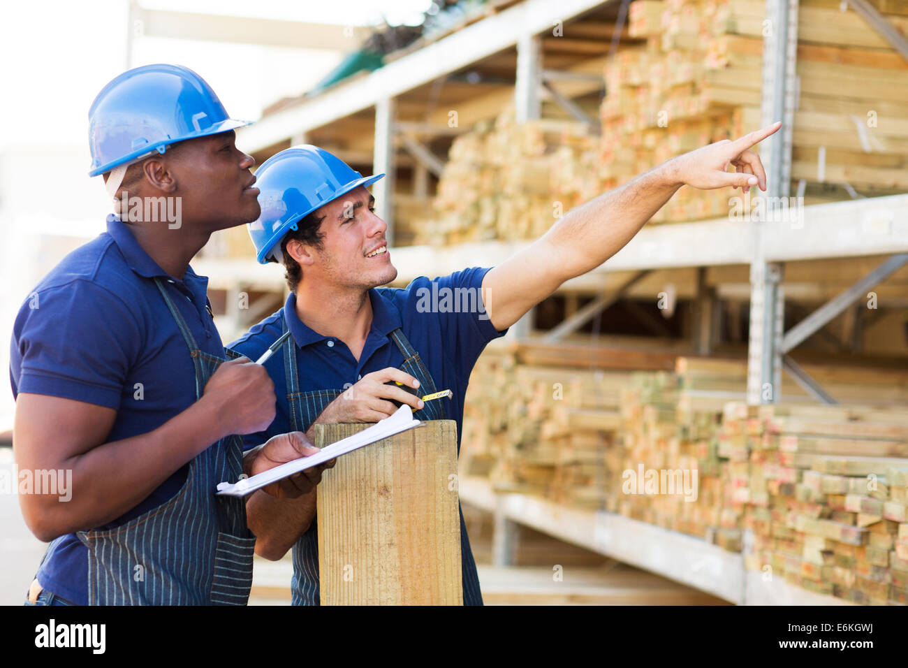 hardware store workers working in timber department Stock Photo - Alamy