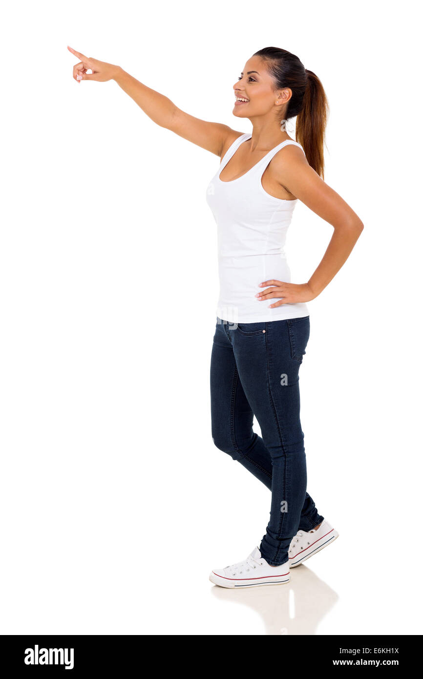 side view of young woman pointing isolated on white background Stock ...