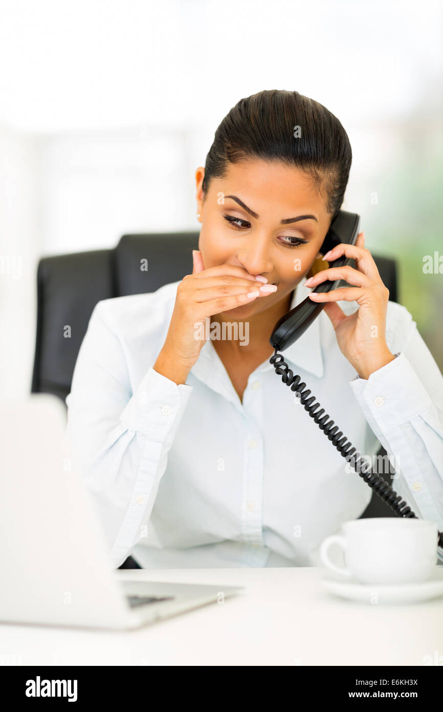 office worker making private call with company phone Stock Photo - Alamy