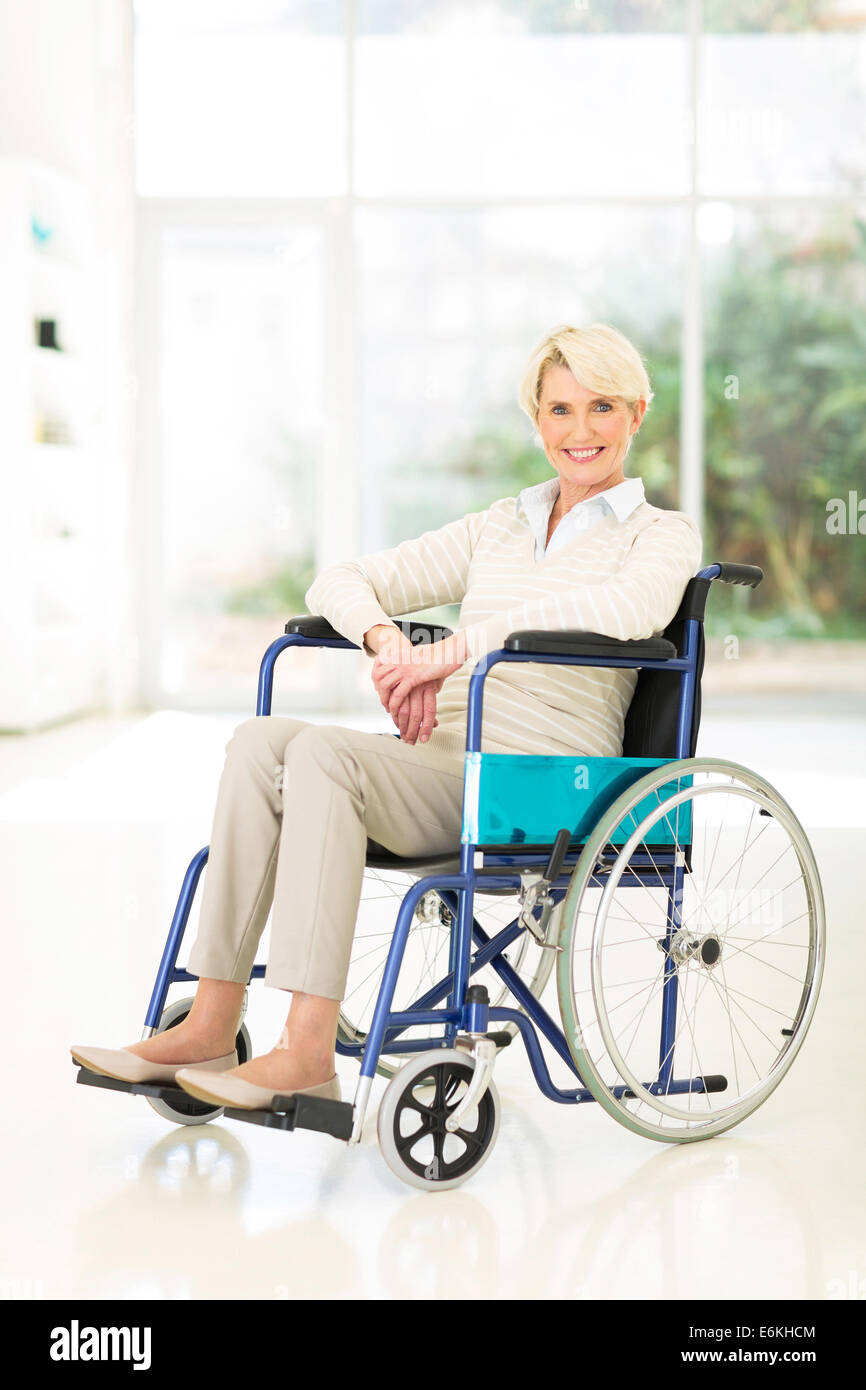 handicapped middle aged woman sitting in wheelchair Stock Photo - Alamy