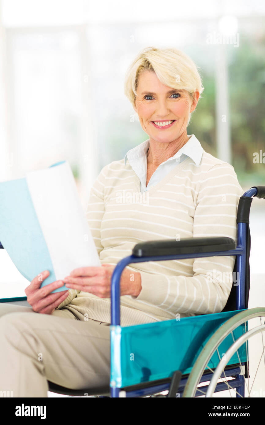 beautiful disabled mid age woman reading a book Stock Photo - Alamy