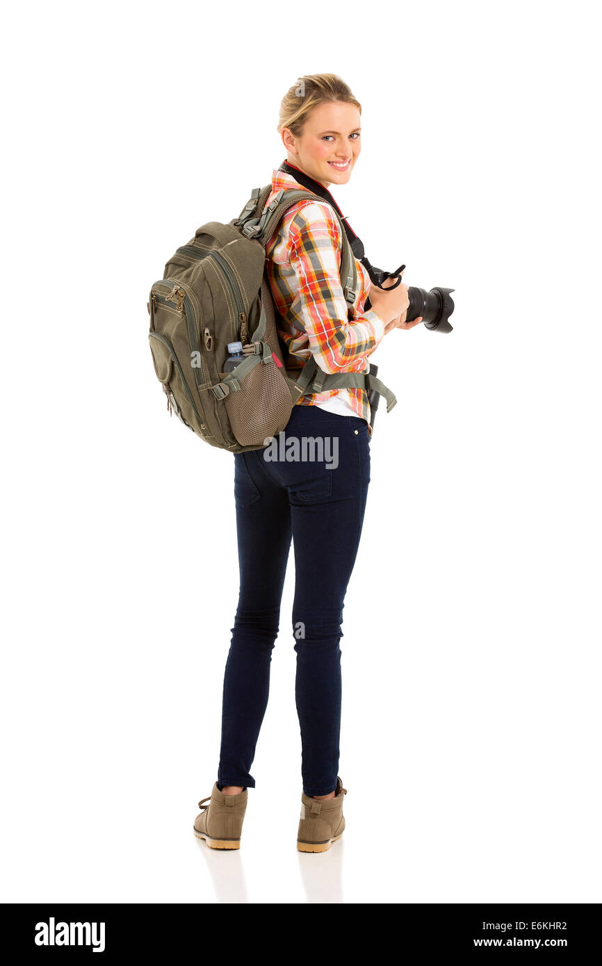 happy female tourist looking back on white background Stock Photo - Alamy
