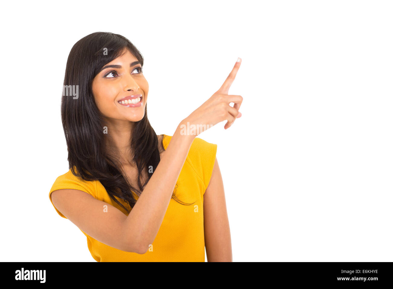 cheerful Indian woman pointing up on white background Stock Photo - Alamy