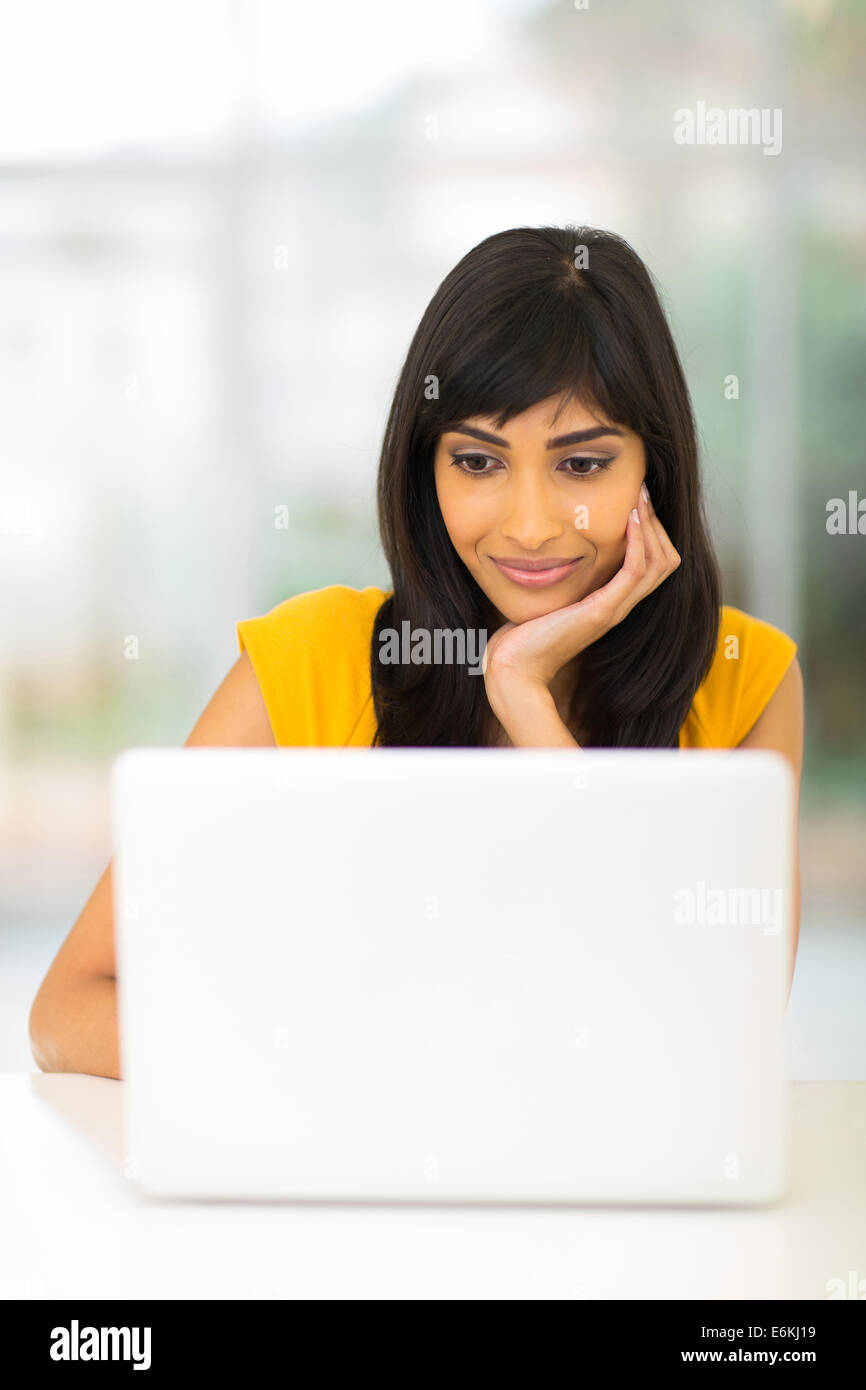 beautiful indian woman looking at computer screen Stock Photo - Alamy