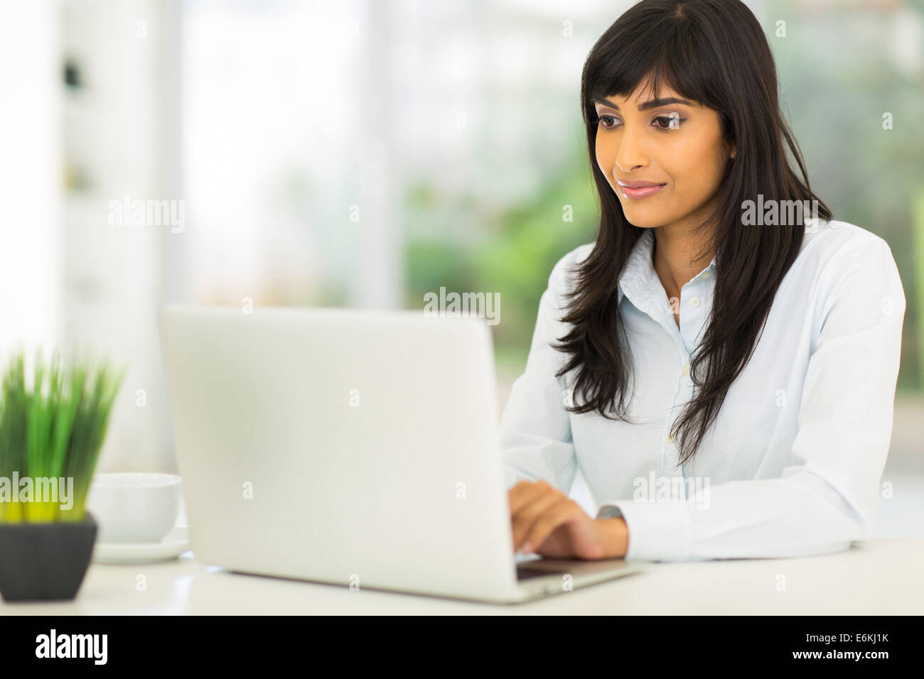 pretty Indian businesswoman using computer in office Stock Photo - Alamy pretty Indian businesswoman using computer in office Stock Photo - Alamy