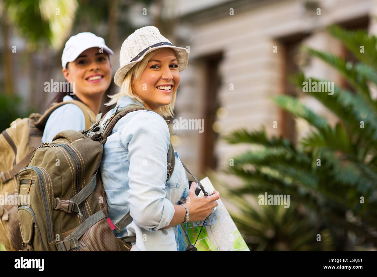 beautiful young tourists looking at the camera Stock Photo - Alamy