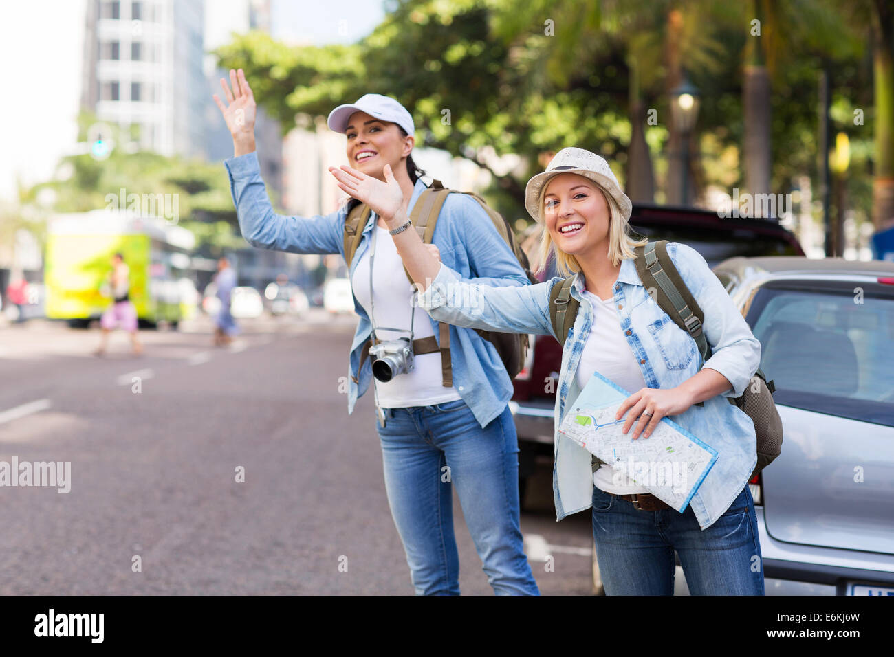 Girl calling taxi hi-res stock photography and images - Alamy