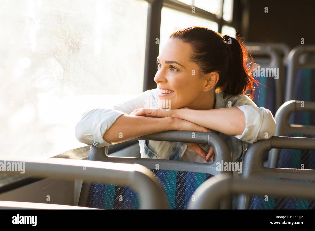 pretty female commuter daydreaming on bus Stock Photo - Alamy