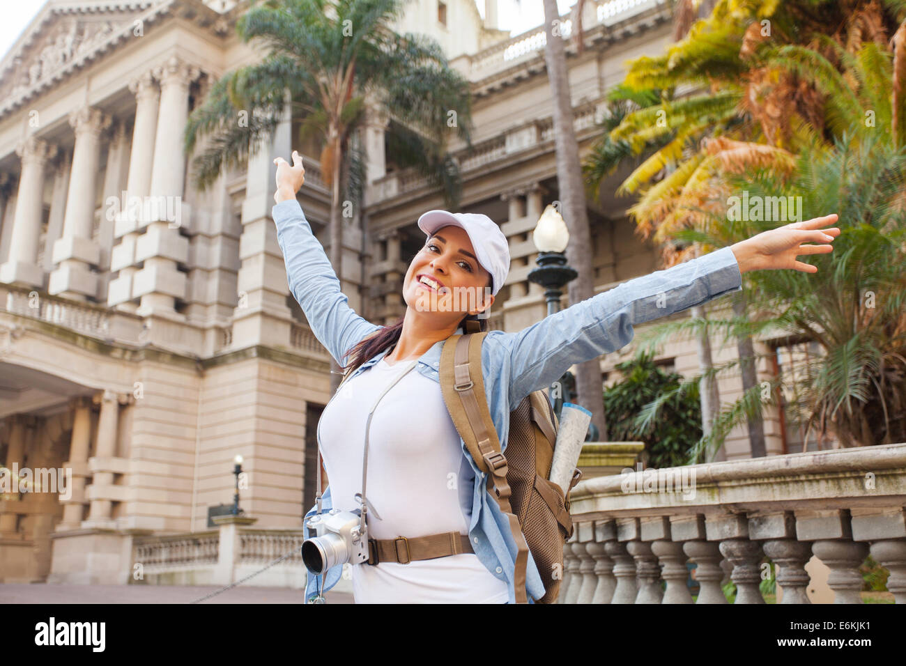 happy tourist posing in front of an historical building Stock Photo - Alamy