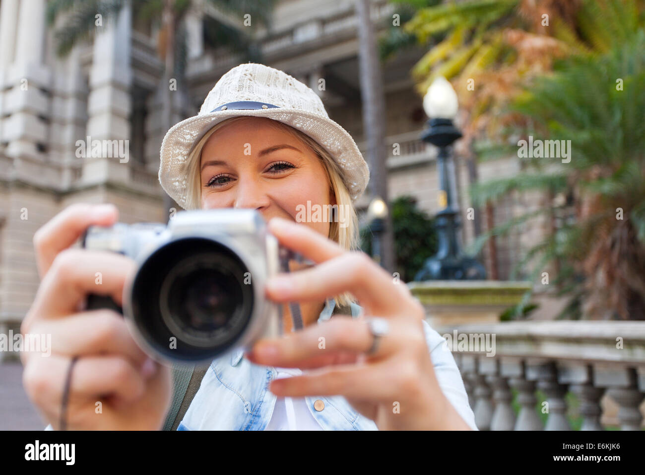 happy tourist taking photos in the city Stock Photo - Alamy