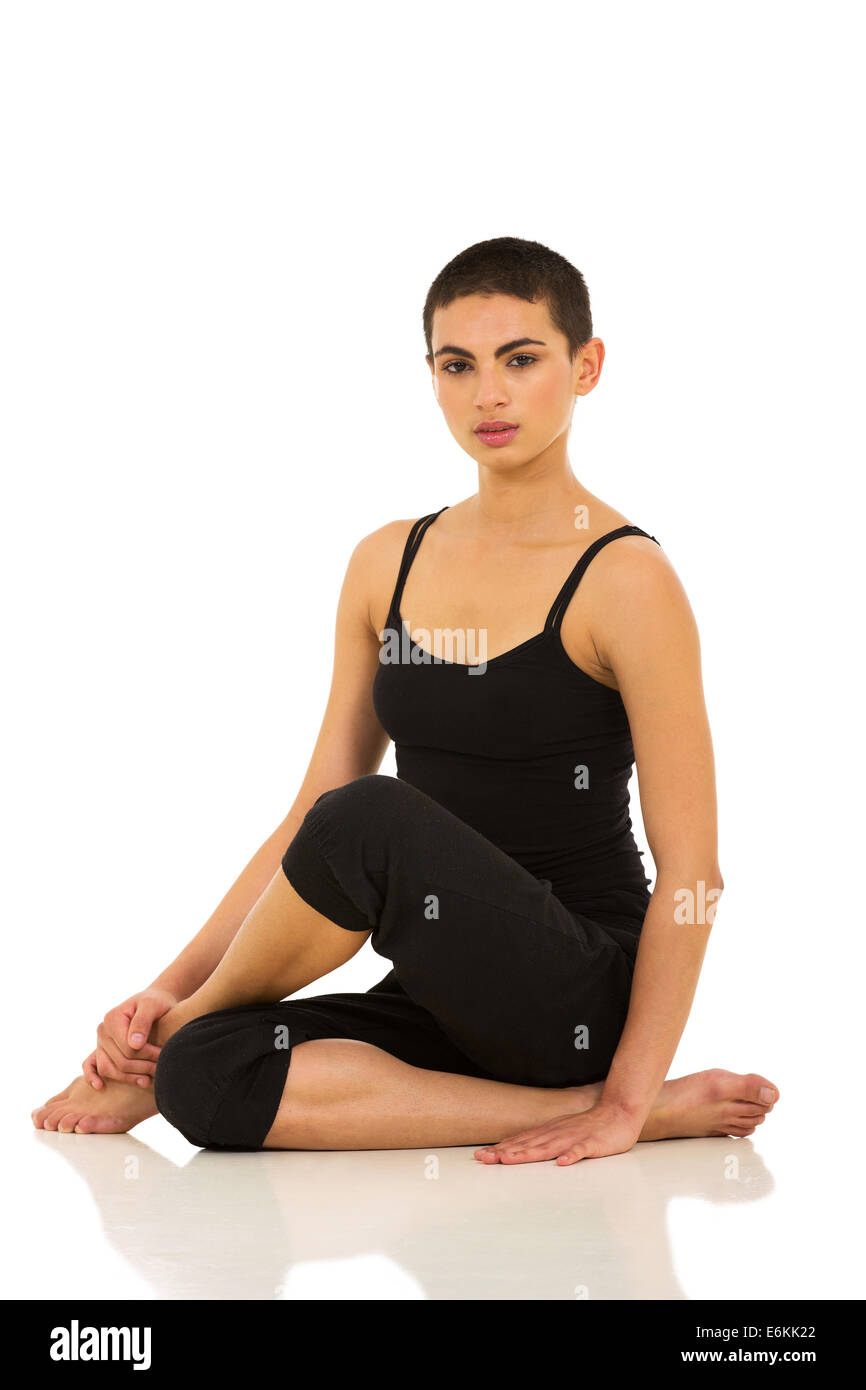 pretty young female dancer sitting on floor isolated on white ...