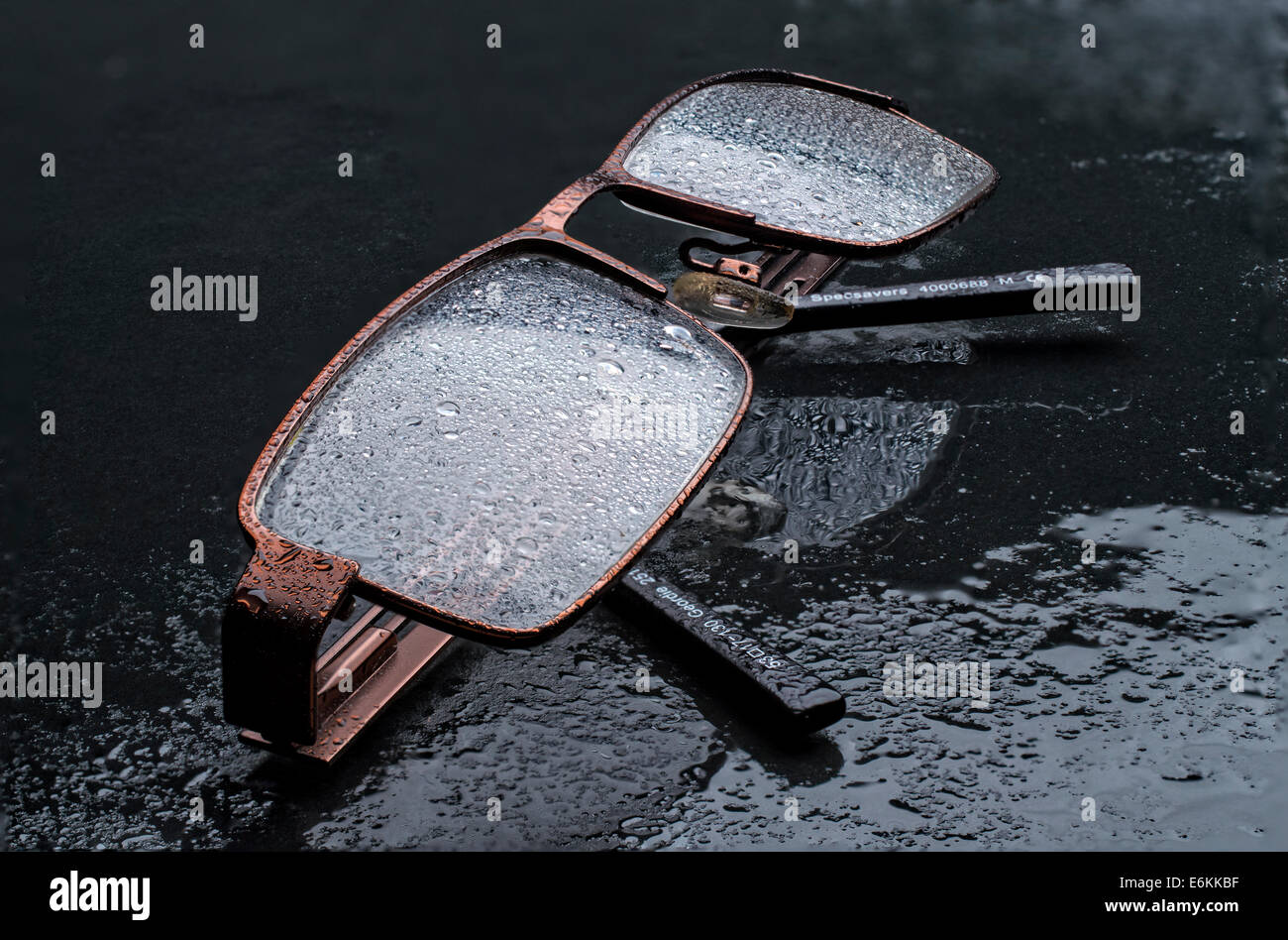A pair of spectacles spattered with raindrops Stock Photo - Alamy