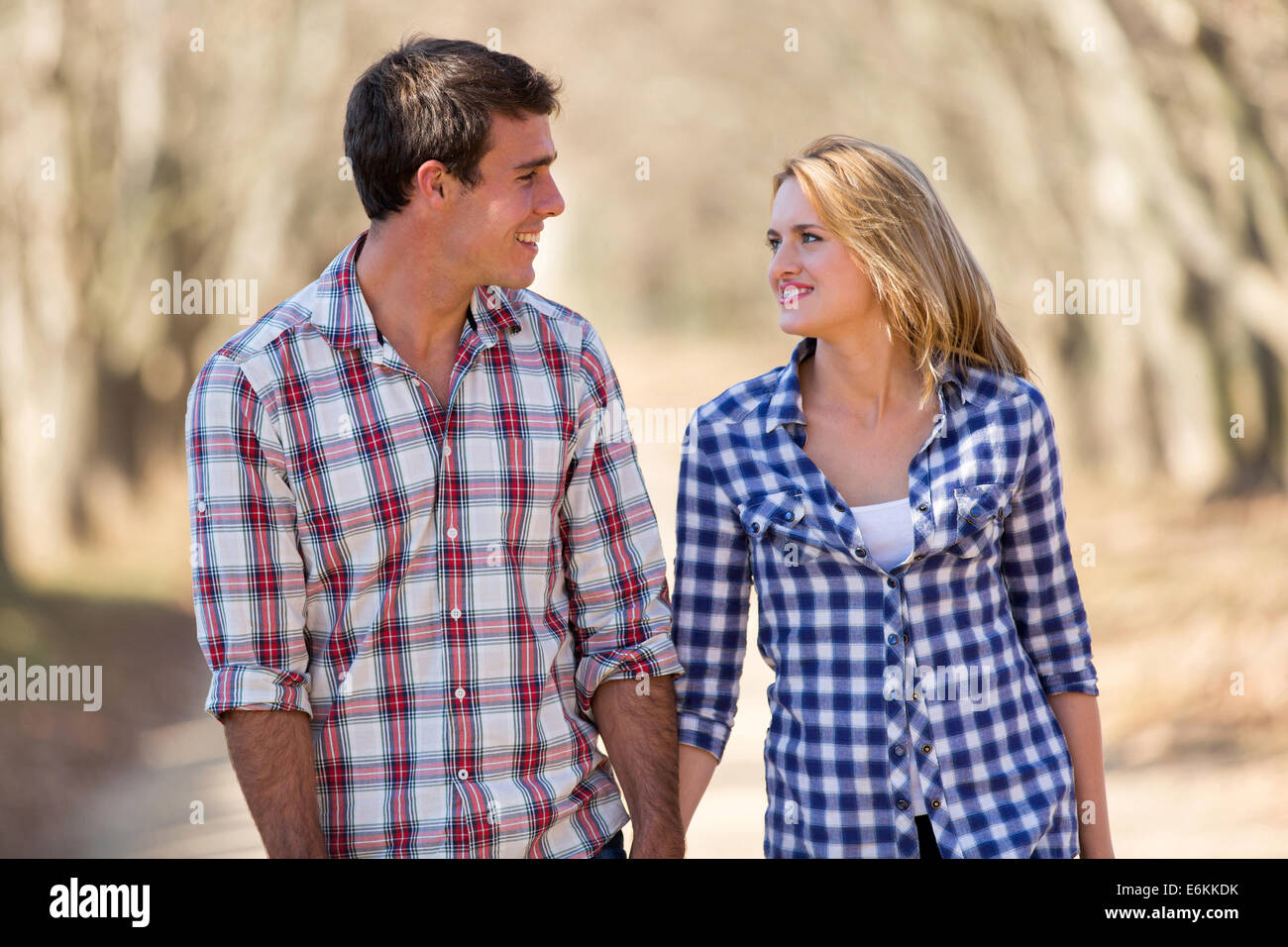 cheerful young couple enjoying a walk in fall Stock Photo - Alamy
