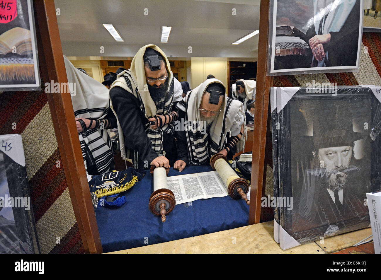 Religious Jewish men reading from the Torah during weekday morning ...