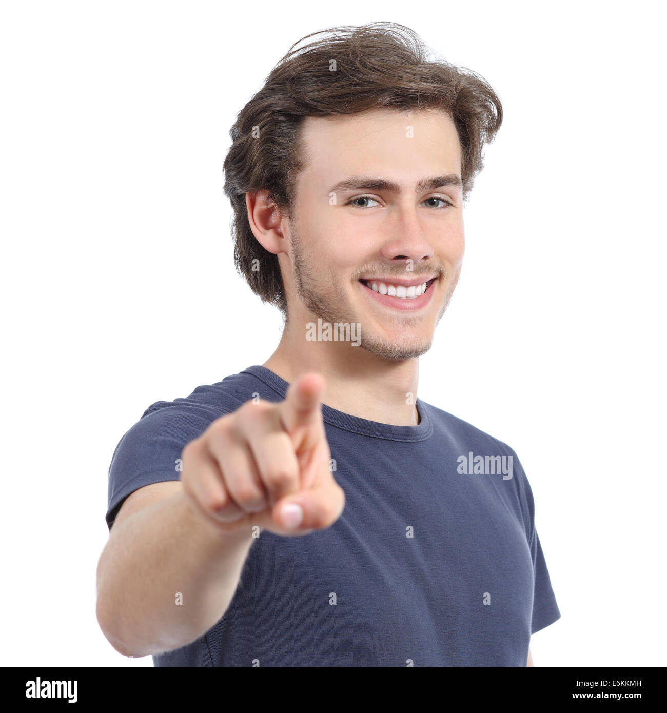 Young man with a perfect white smile pointing at camera isolated on a ...