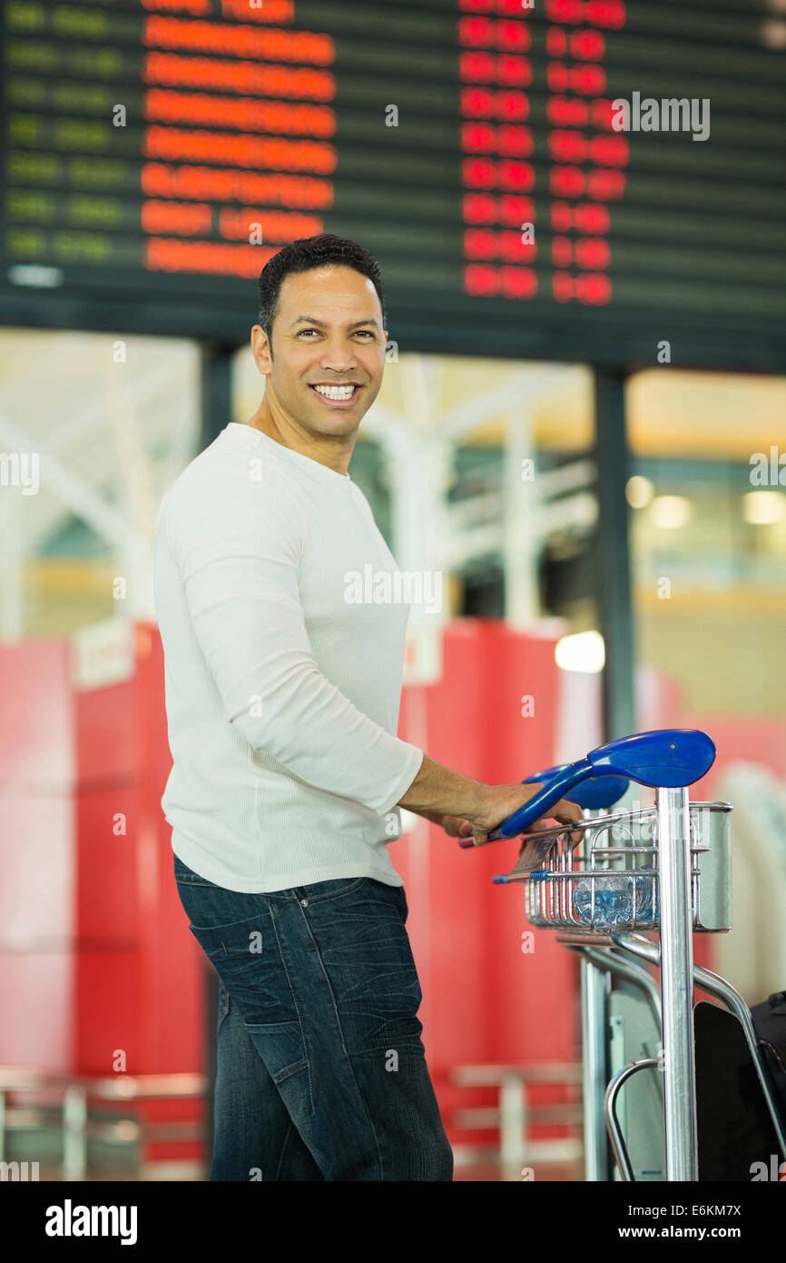 Man pushing trolley in airport hi-res stock photography and images - Alamy