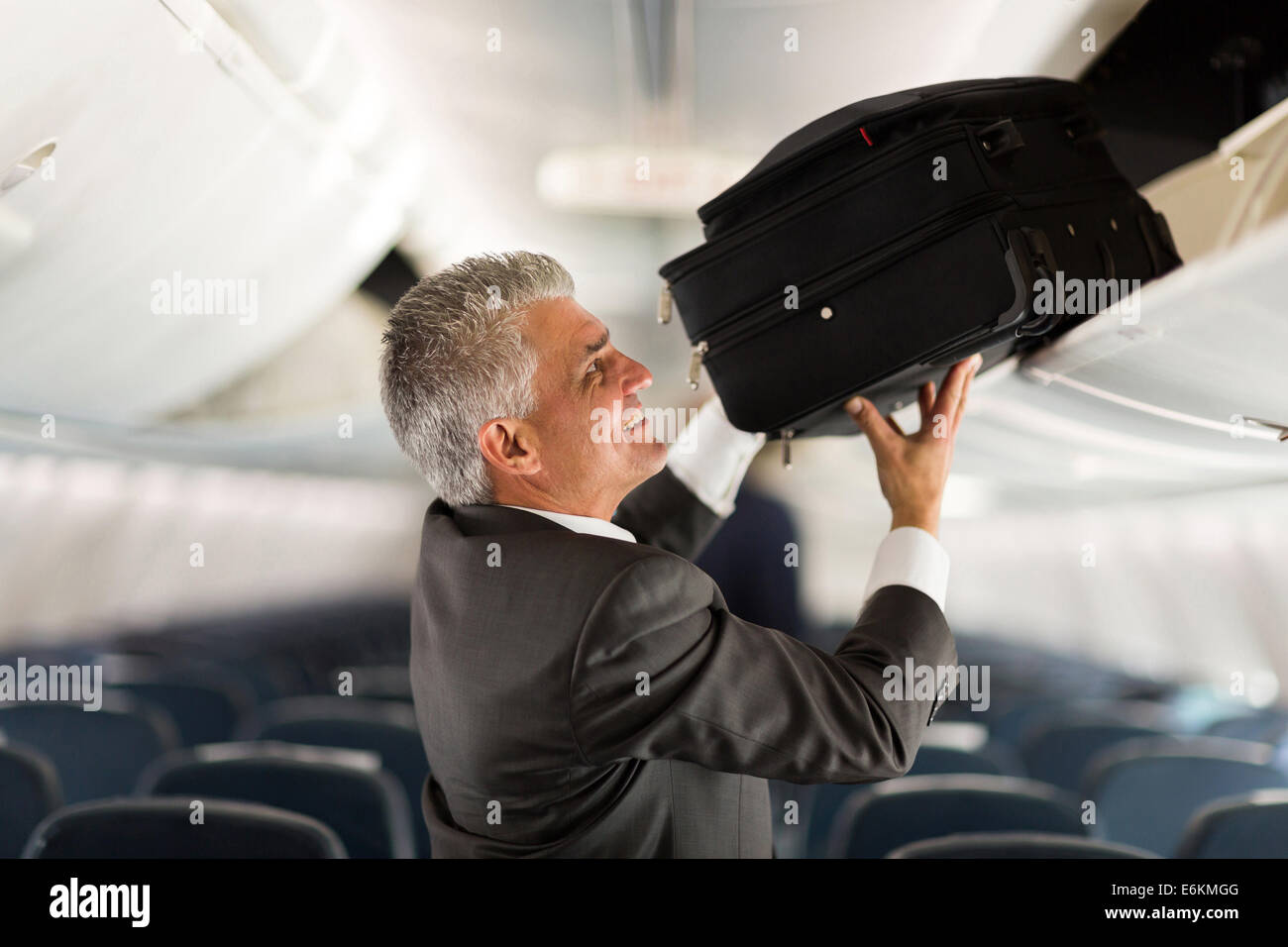 Overhead locker airplane hi-res stock photography and images - Alamy