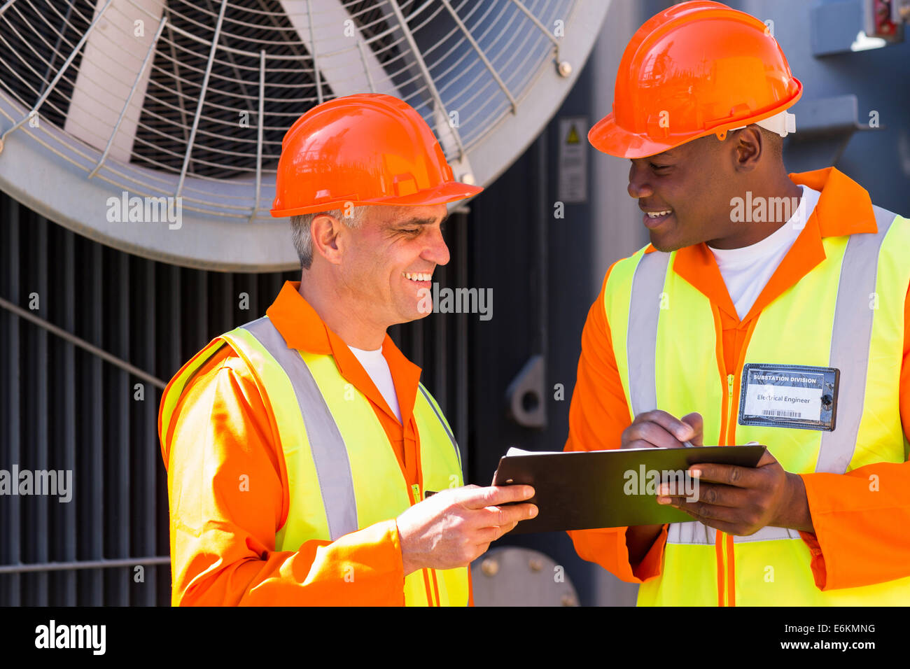 happy power company technical co-workers working in front of ...