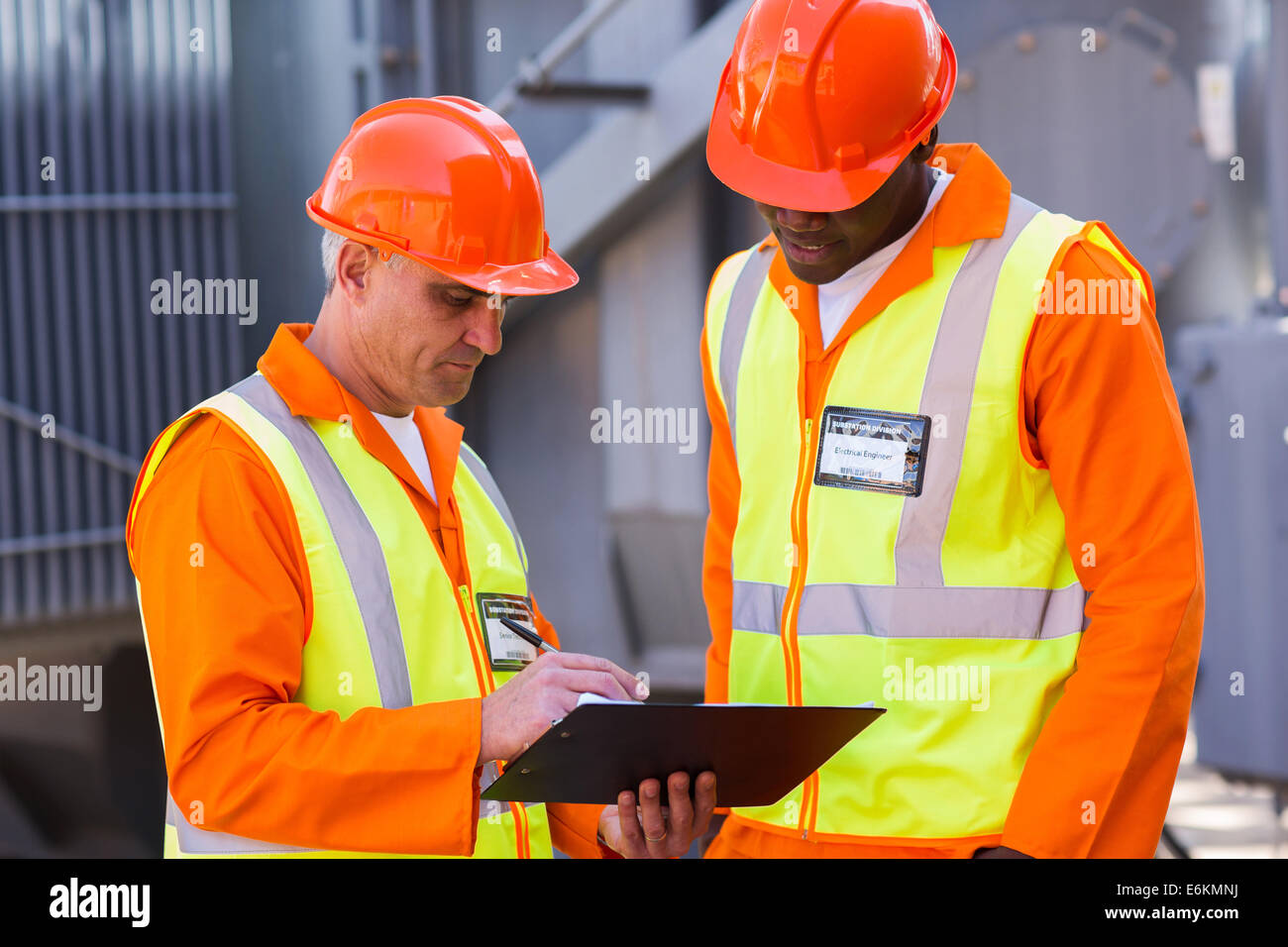 professional technical workers working at power plant Stock Photo - Alamy