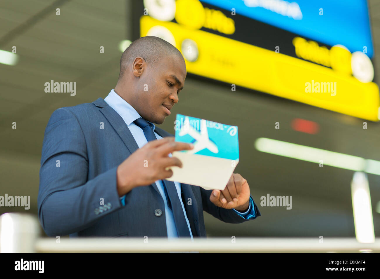 professional African American business traveller checking time at ...