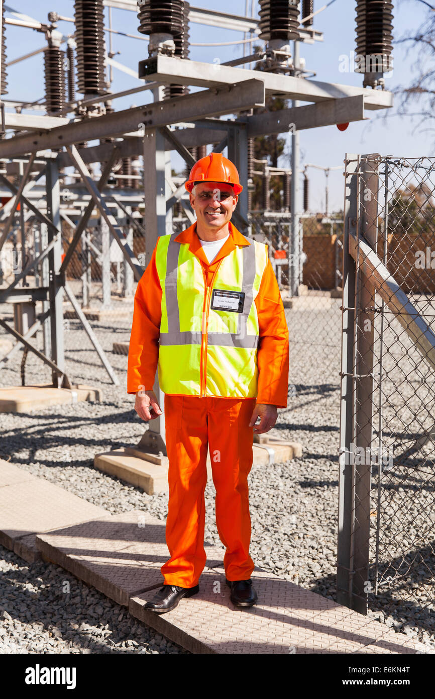 handsome senior technician standing in power plant Stock Photo - Alamy