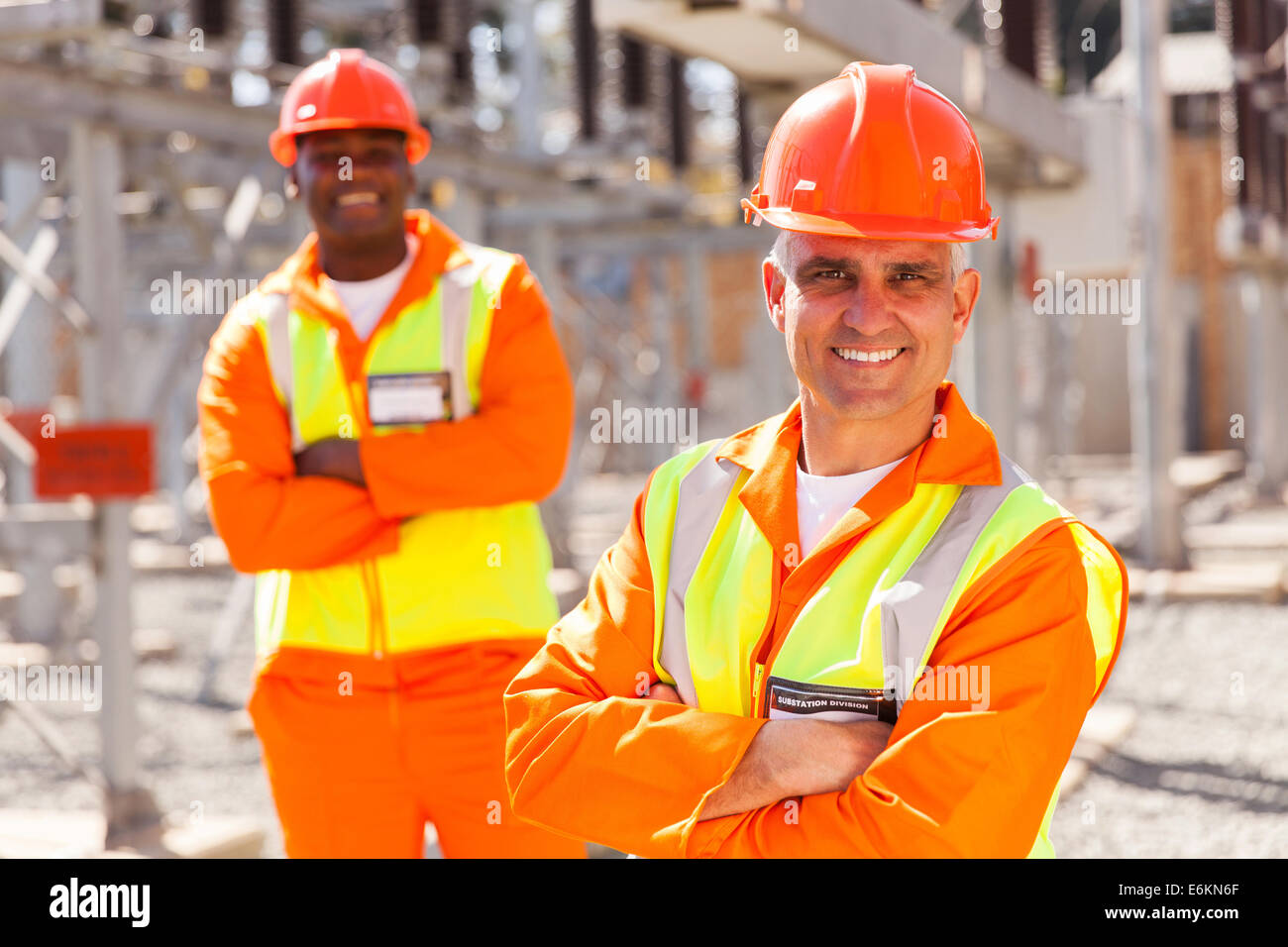 two electricity company workers in substation Stock Photo - Alamy