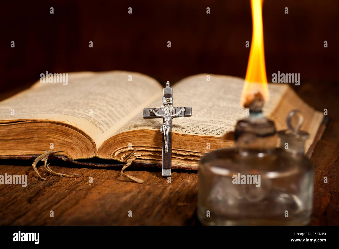 Old Holy Bible, glass gaslight and Crucifix on wooden background Stock ...