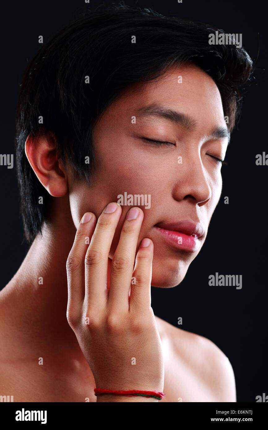 Closeup portrait of a Young Asian man with toothache Stock Photo - Alamy