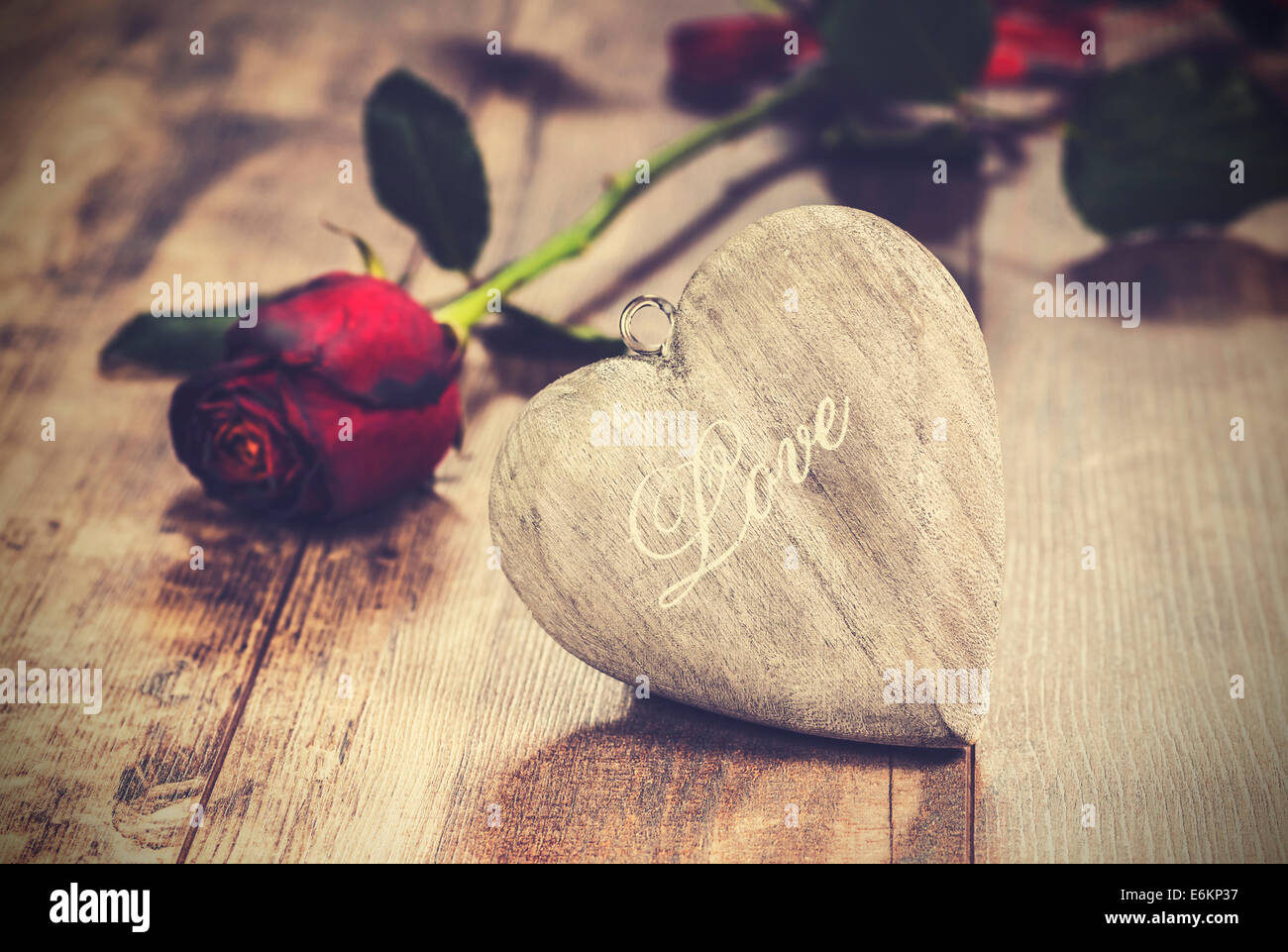 Vintage picture of heart on a wooden background with red rose ...