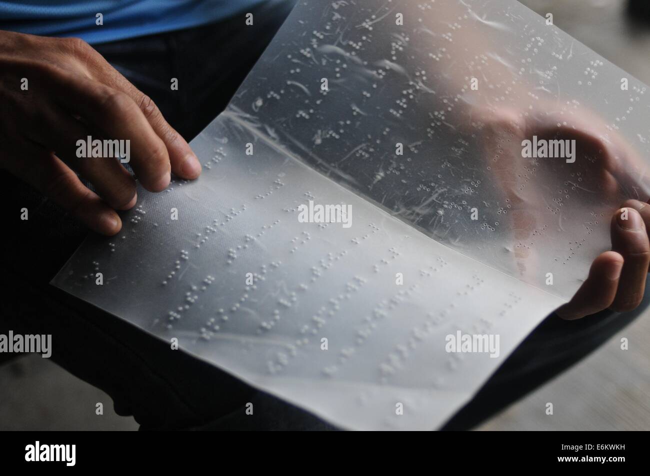 Blind man reading braille in hi-res stock photography and images - Alamy