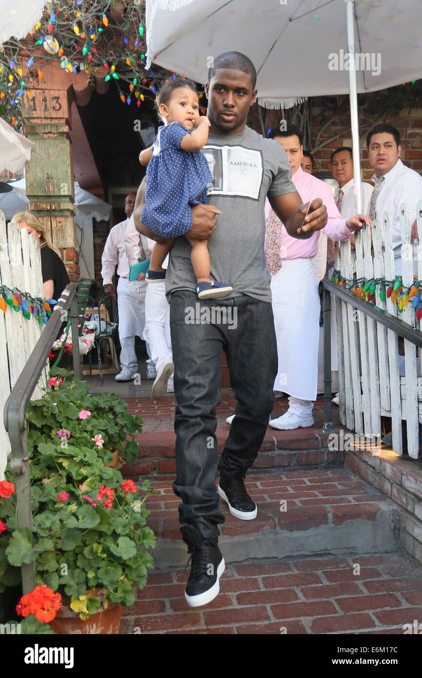 Reggie Bush and partner Lilit Avagyan with their daughter Briseis seen ...