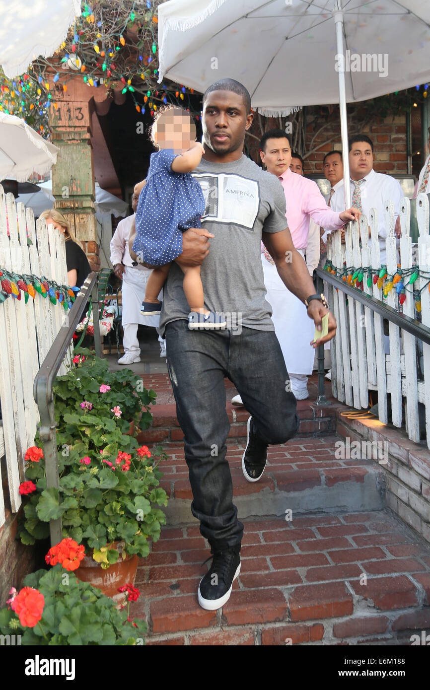Reggie Bush and partner Lilit Avagyan with their daughter Briseis seen ...