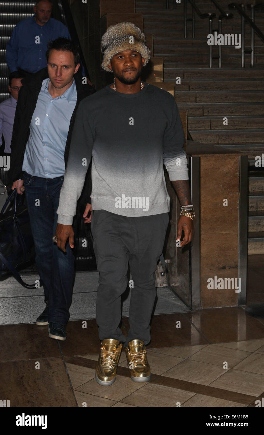 Usher arrives at Los Angeles International Airport (LAX) wearing gold ...