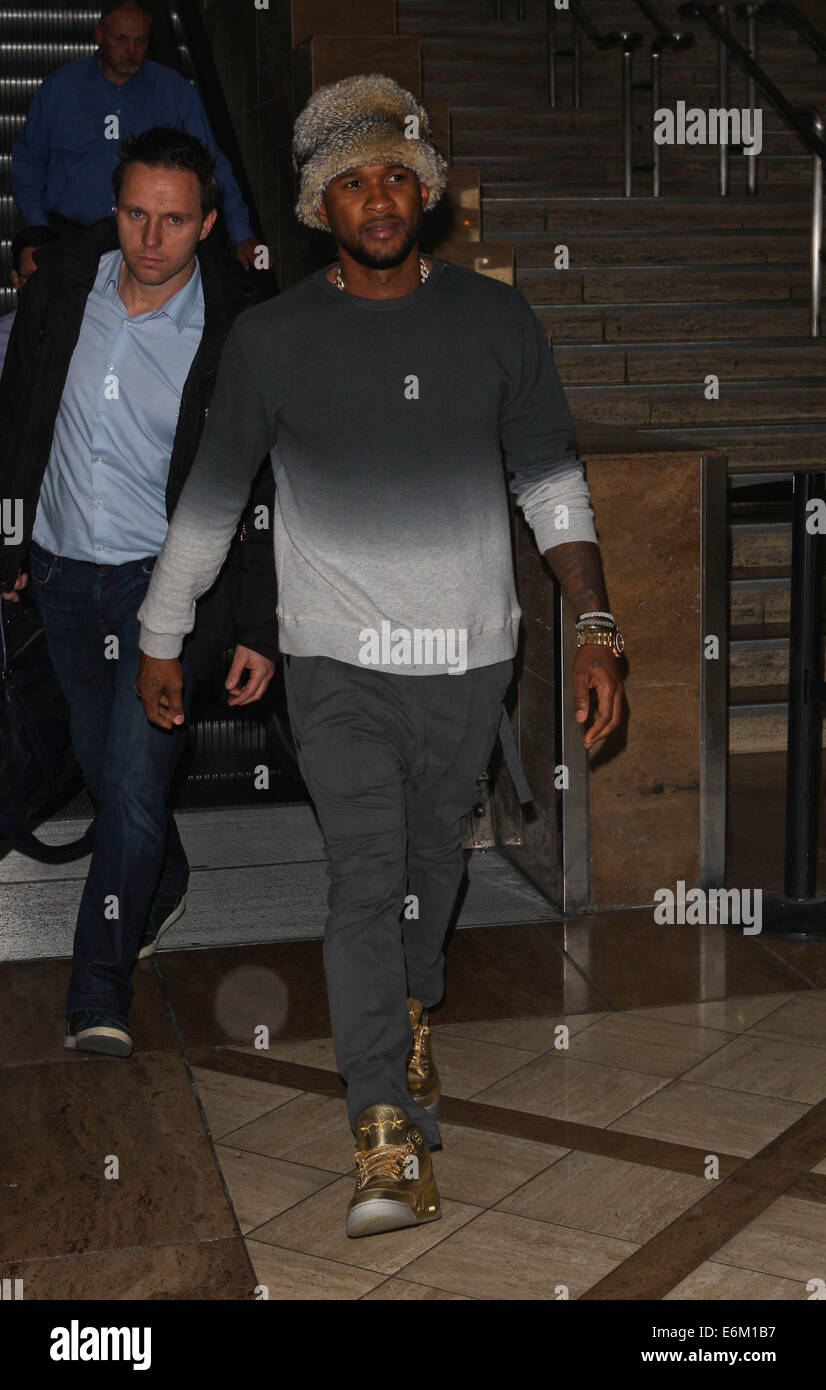 Usher arrives at Los Angeles International Airport (LAX) wearing gold ...