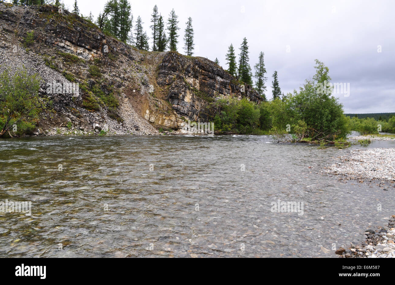 Rocky coast of Northern taiga mountain river in the area of the Polar ...