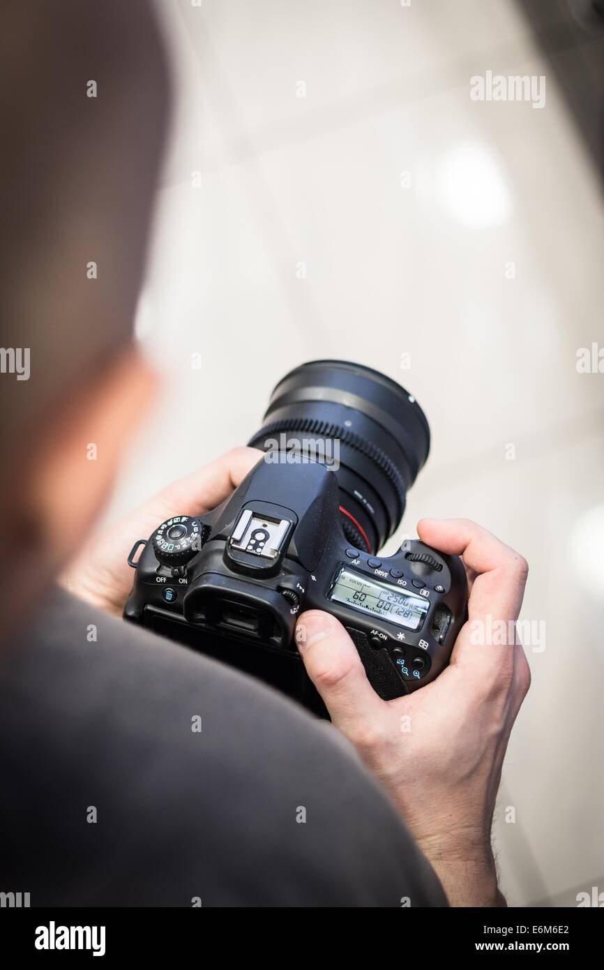 A photographer's camera and lens, shown in this image, represent ...