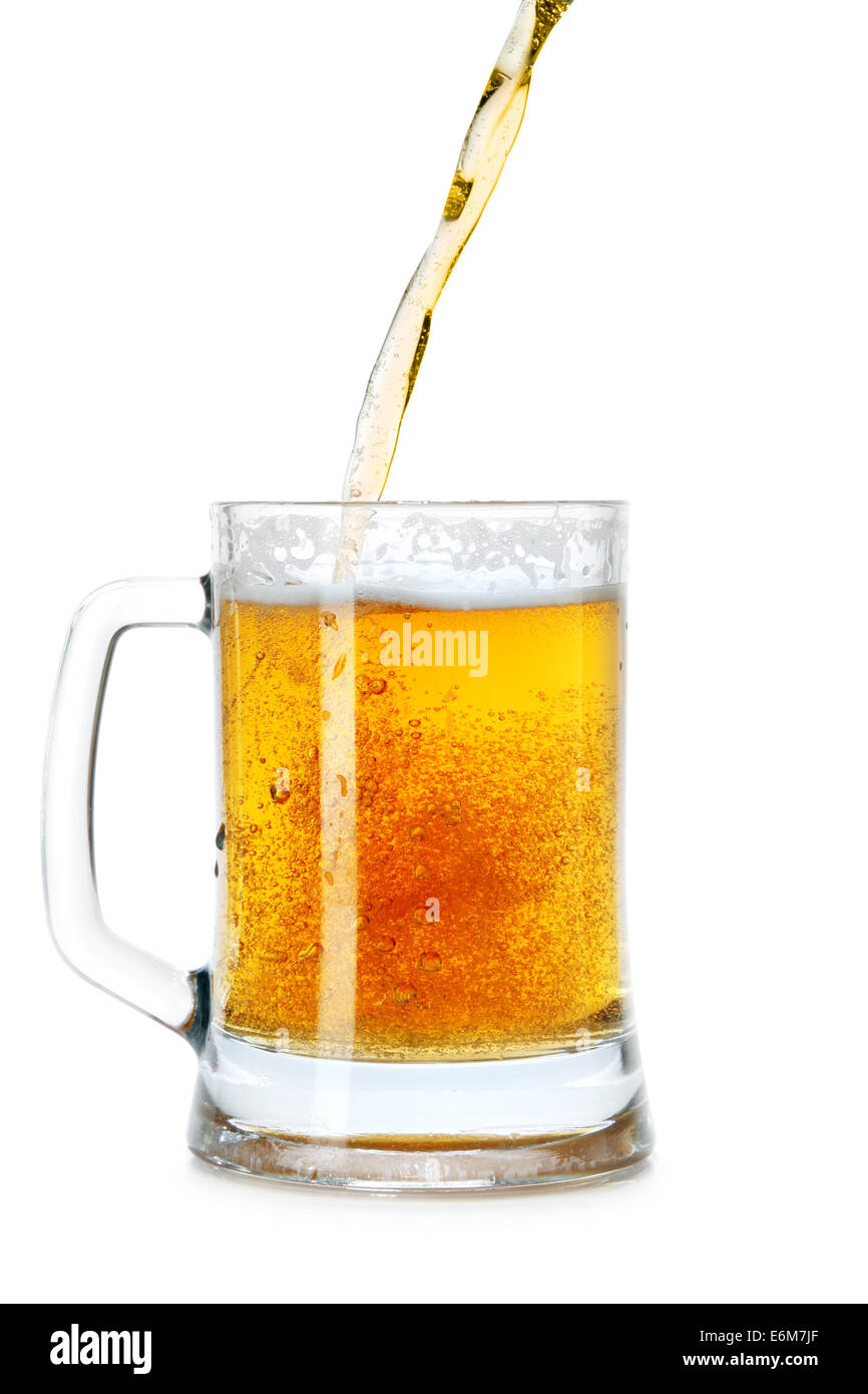 Pouring beer into mug isolated over a white background Stock Photo - Alamy