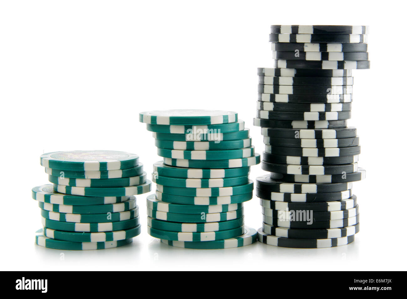 Three stacks of casino chips in a row isolated over a white background ...