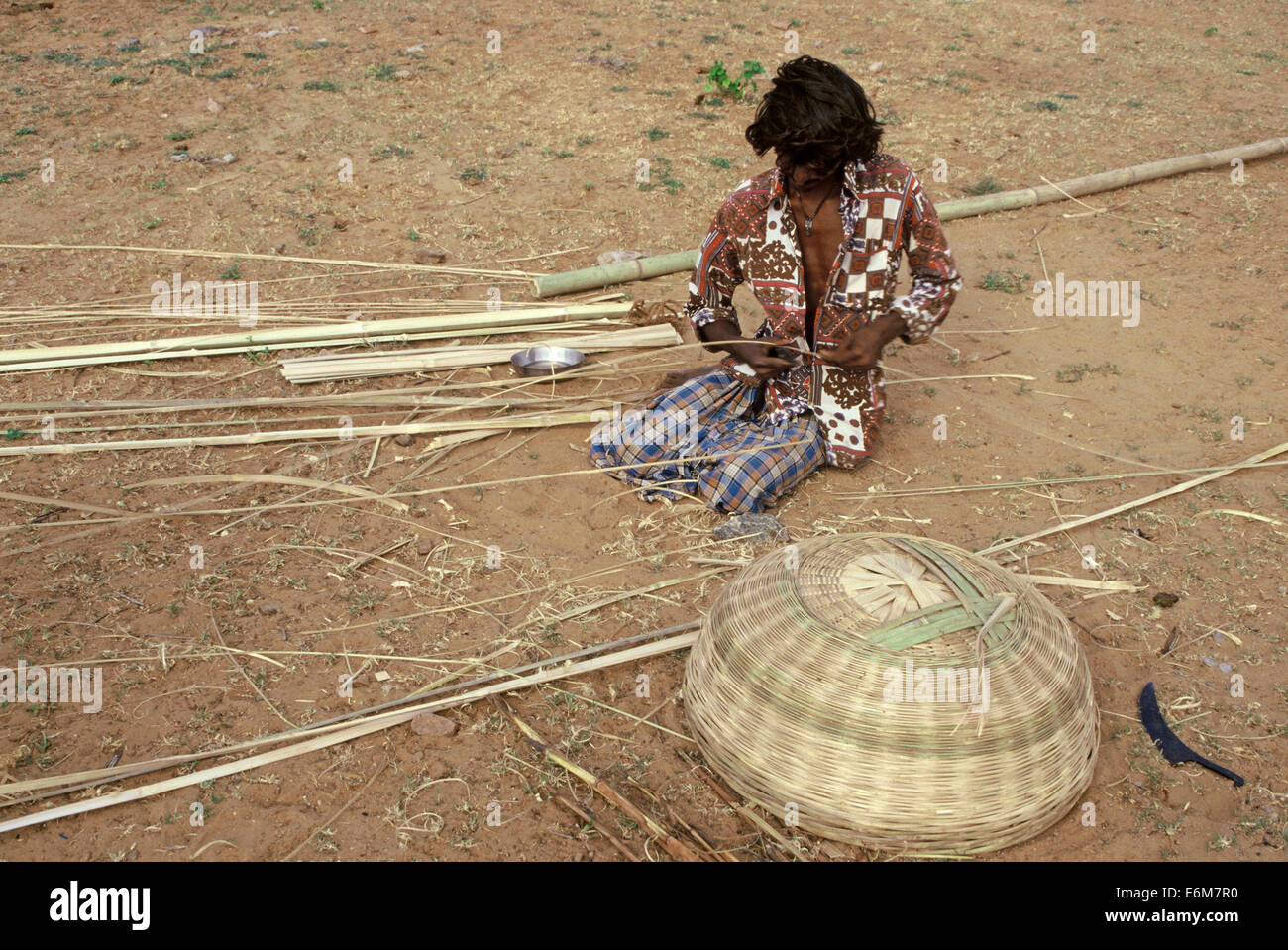 Basket maker working. He belongs to a very low caste ( India Stock ...